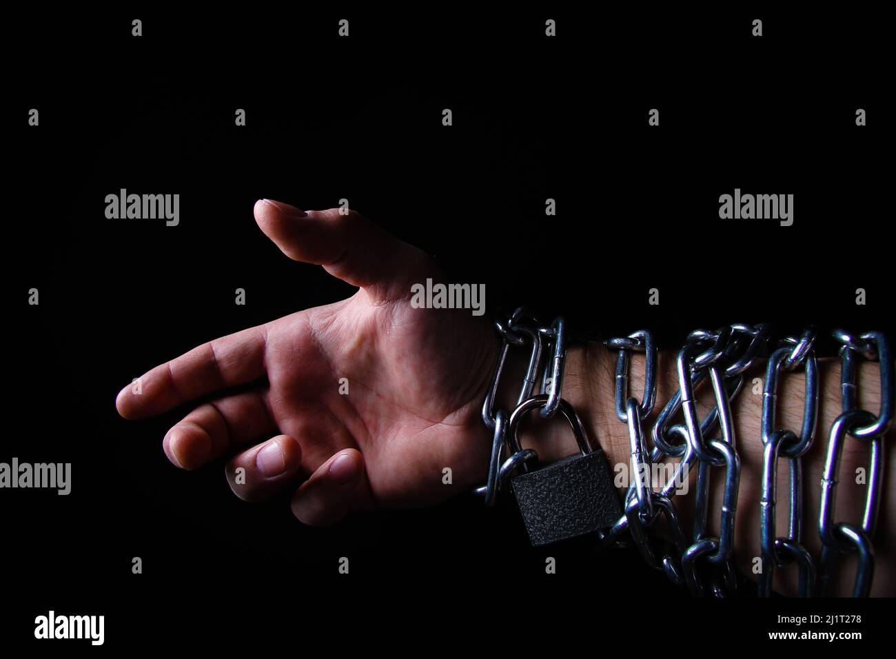 Chain and lock on hand. Arrest of a criminal. Handcuffs on the prisoner ...