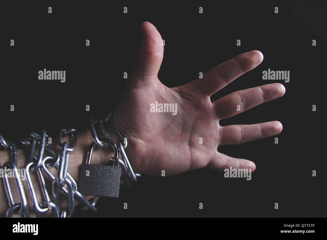 Chain and lock on hand. Arrest of a criminal. Handcuffs on the prisoner ...