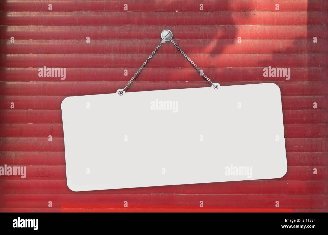 White signboard hanging on red shutter. Advertisement Stock Photo - Alamy