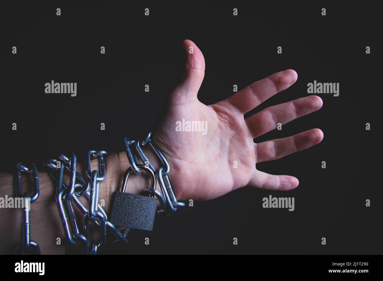 Chain and lock on hand. Arrest of a criminal. Handcuffs on the prisoner ...