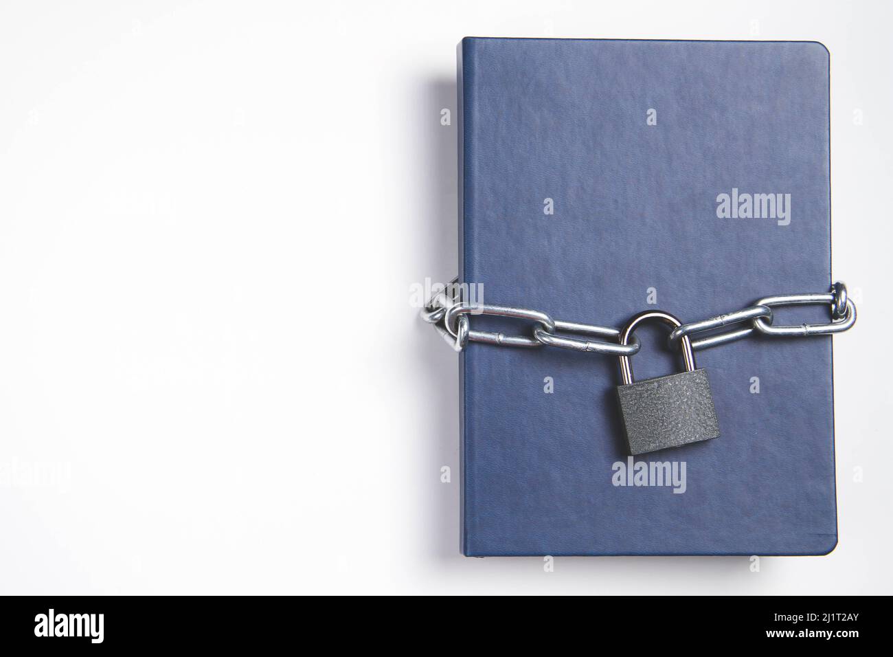 The book is locked under lock and key on a white background. Secret ...