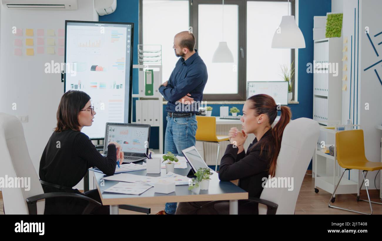 Workmates joining business meeting for project briefing and planning ...