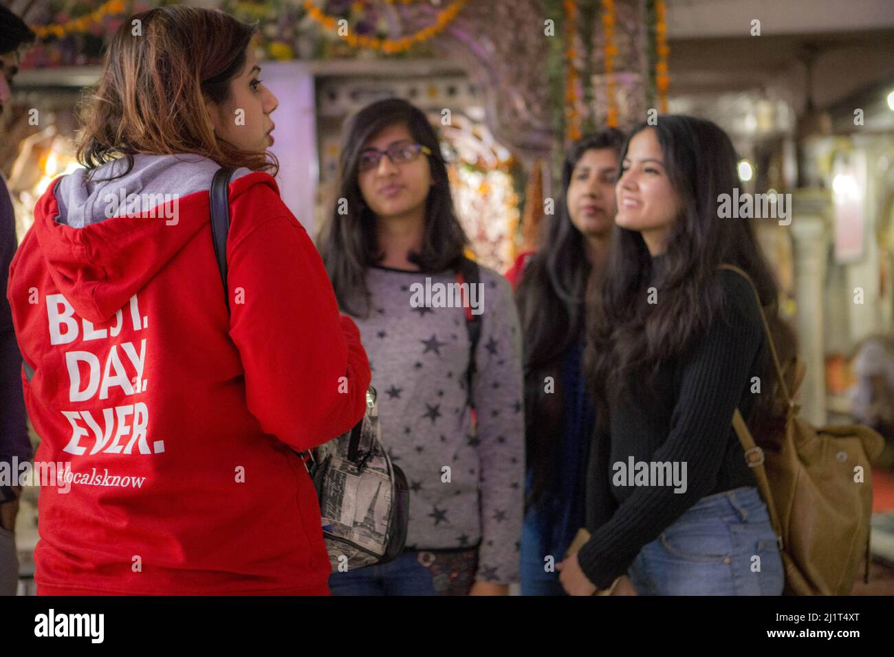 A view of a group of tourists and locals at a Hindu temple during ...
