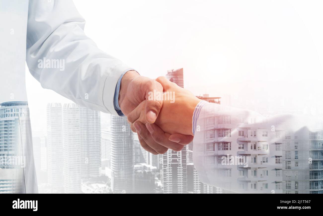 Handshake between nurse doctor hi-res stock photography and images - Alamy