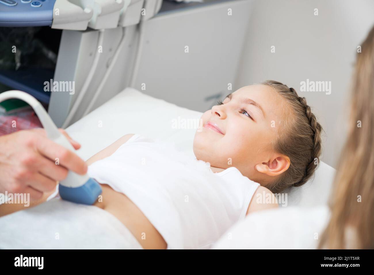 Medical procedure of smiling little girl Stock Photo - Alamy