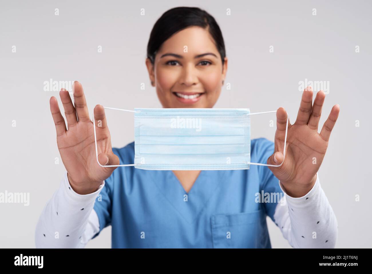 Lets cover your face to save the world. Portrait of a young doctor ...