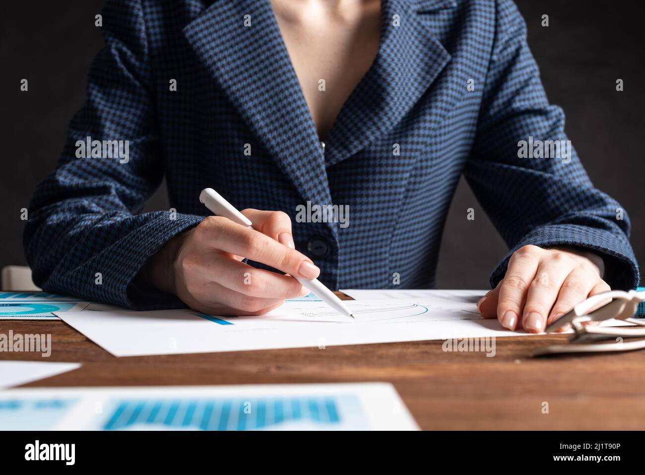 Investment manager analyze financial diagram Stock Photo - Alamy