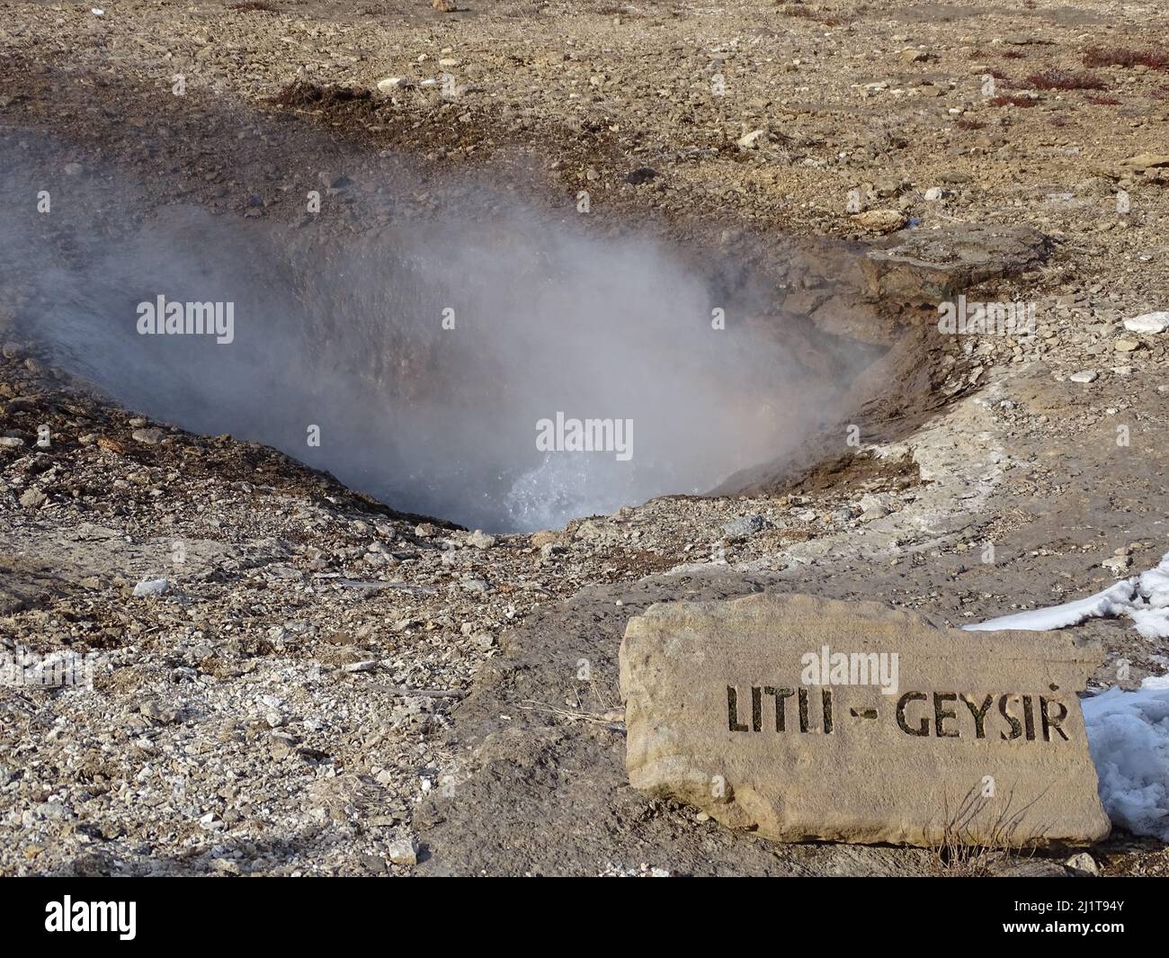 A view of the hot steam coming out from the ground in the great Geysir ...