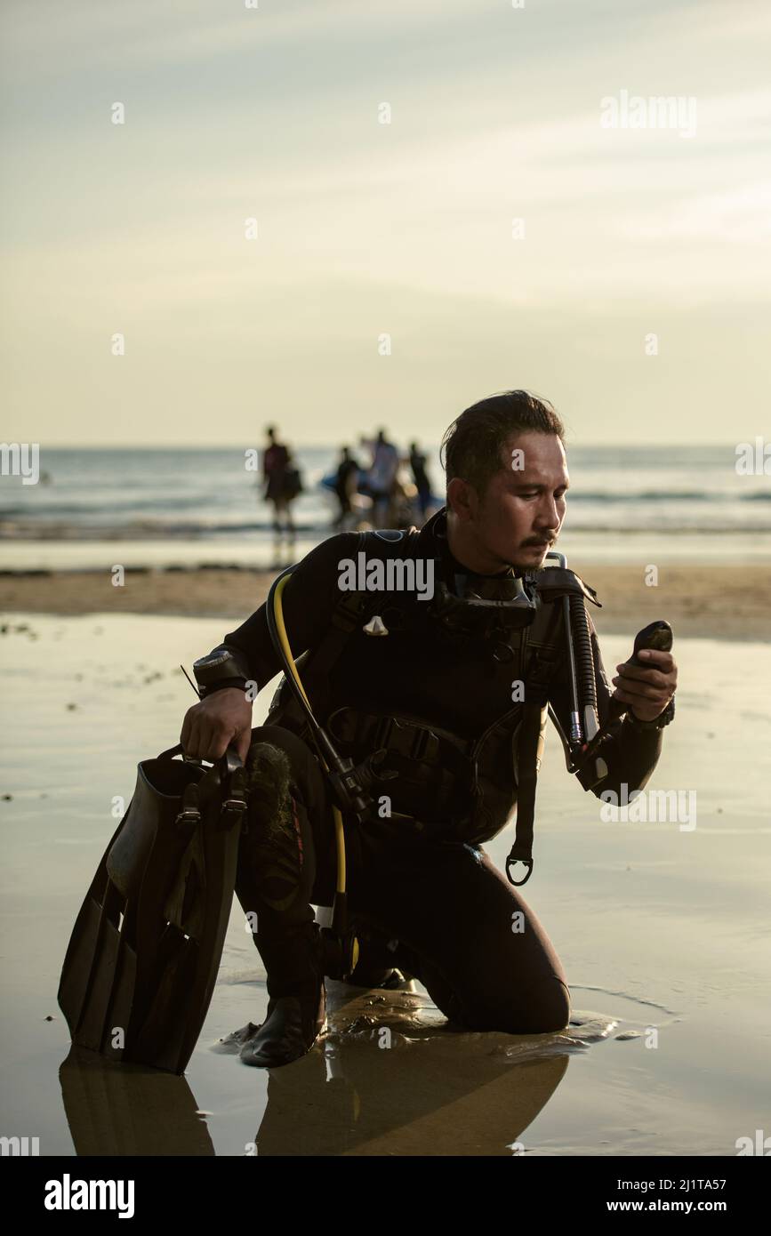 diver rescue in wetsui equipment for scuba diving. The concept of ...