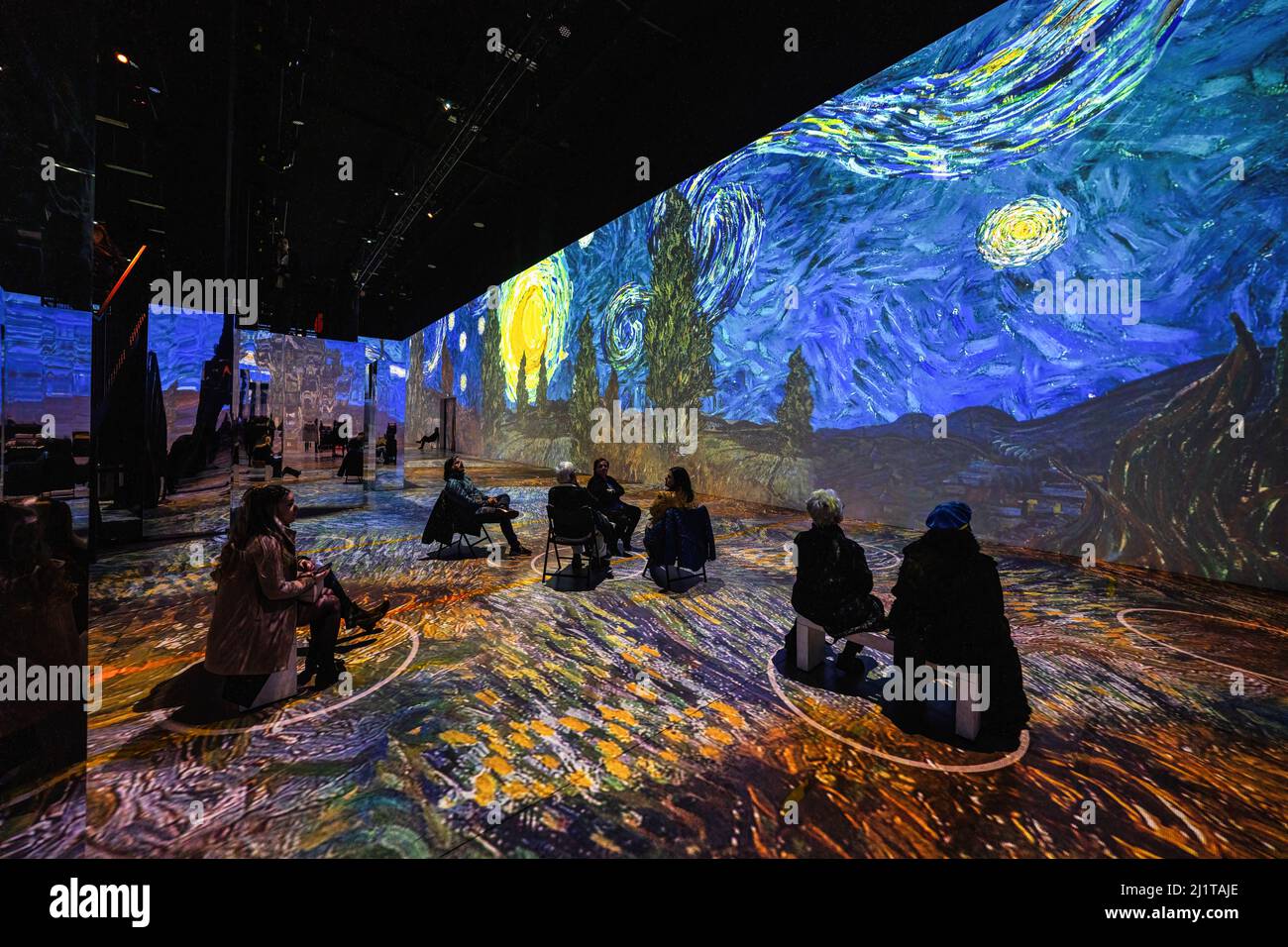 Toronto, Canada. 26th Mar, 2022. People seen sitting while looking at ...