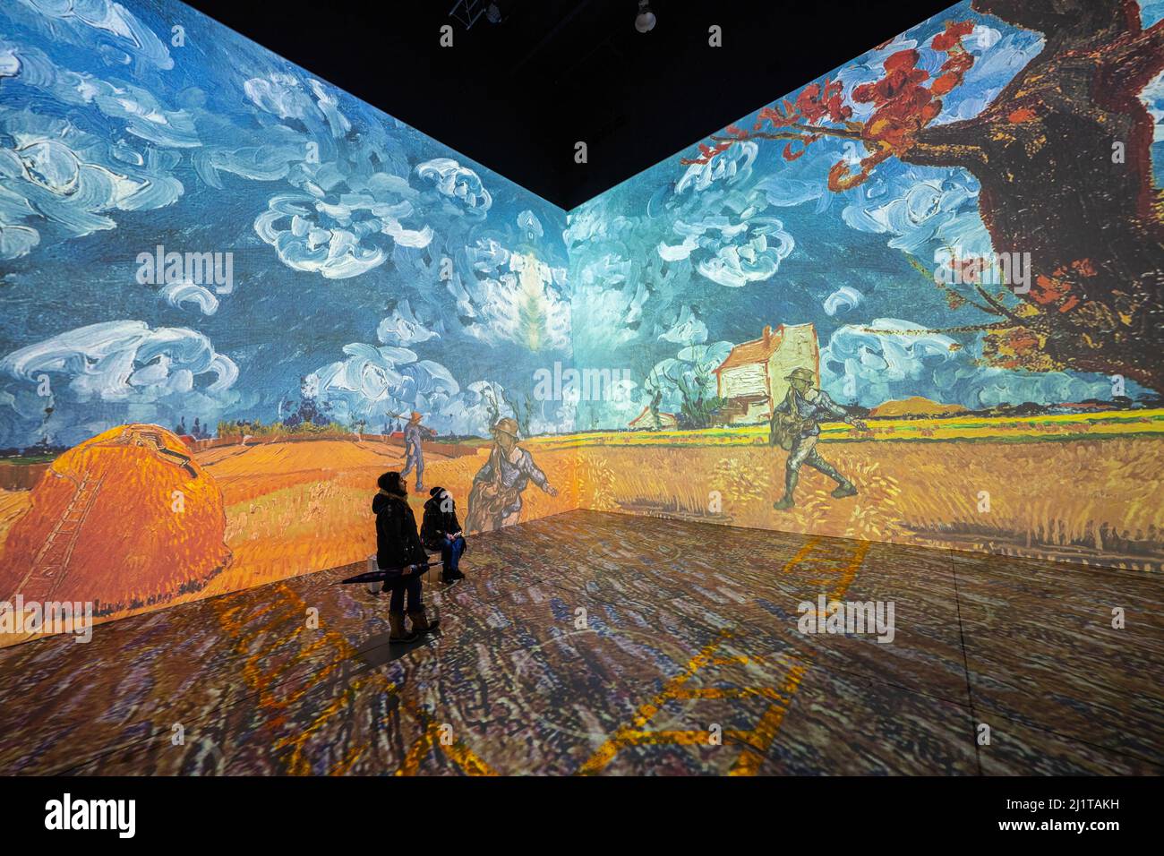 Toronto, Canada. 26th Mar, 2022. Two people sitting seen looking at an ...