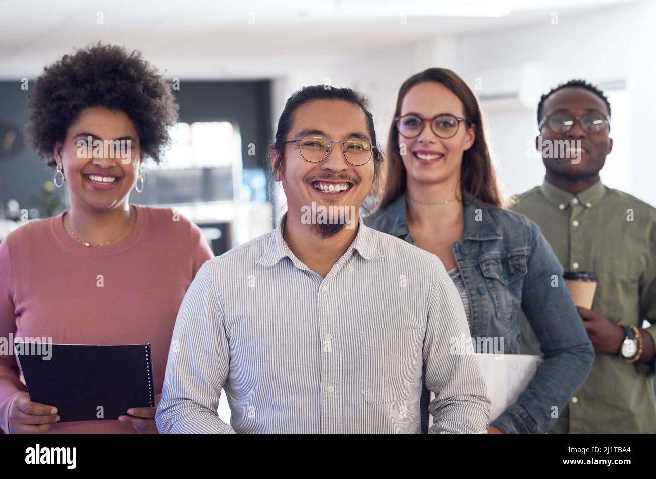 Teamwork keeps a business moving forward. Portrait of a group of ...