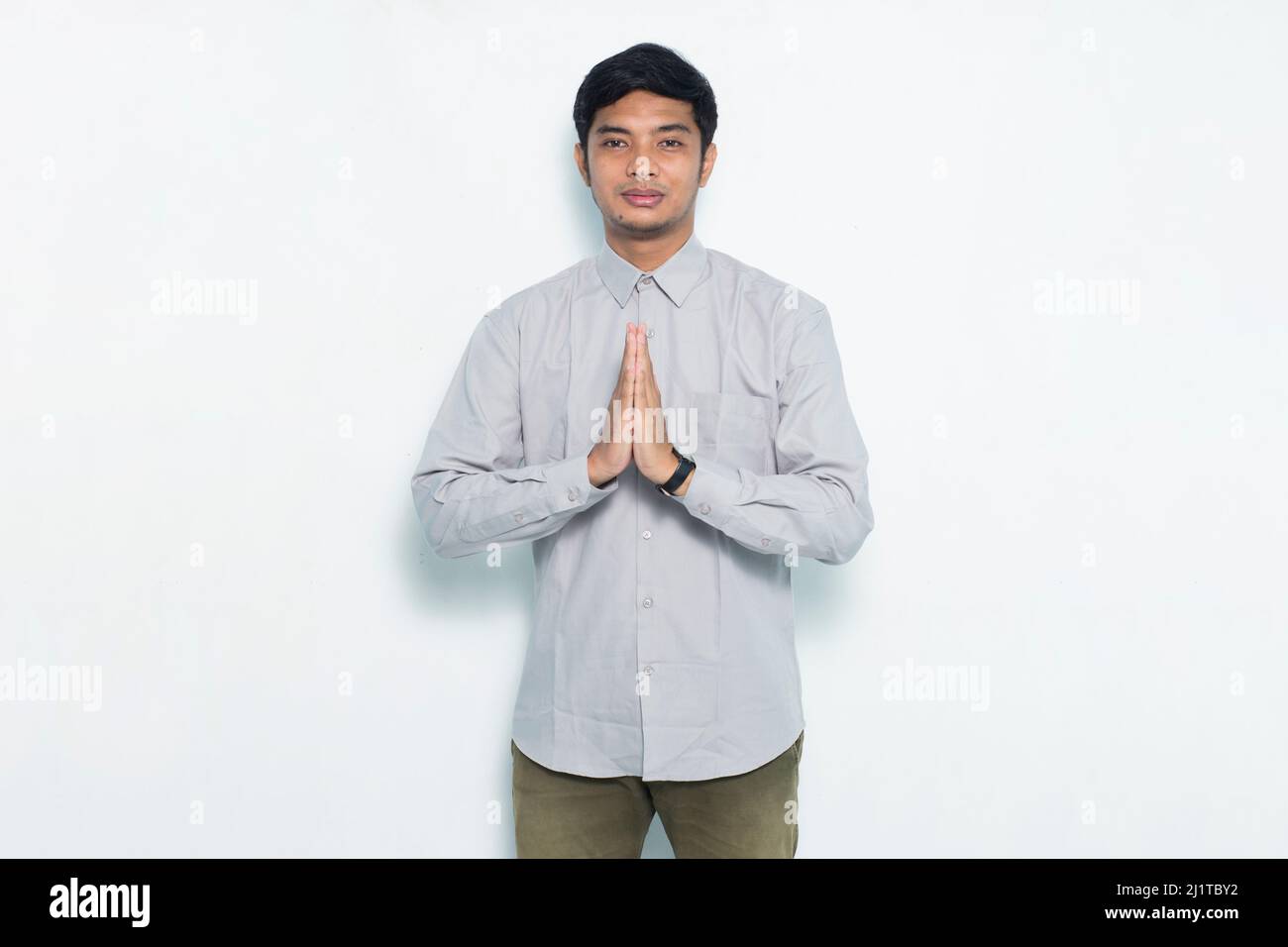 asian man with welcoming guests gesture isolated on white background ...