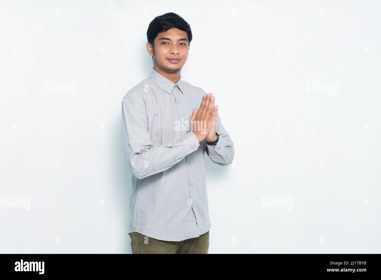 asian man with welcoming guests gesture isolated on white background ...
