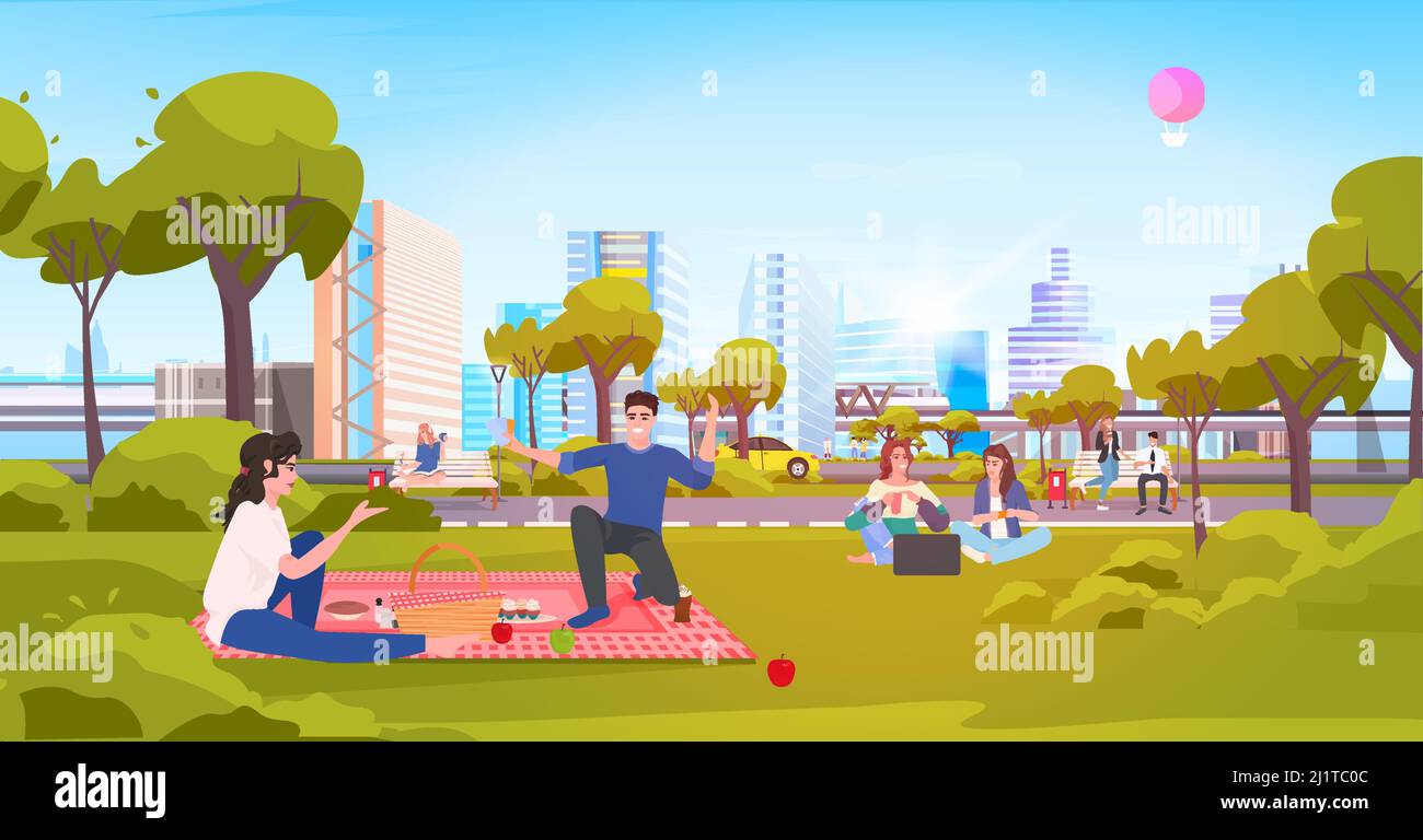 Happy people having picnic in urban park group of men women sitting on ...