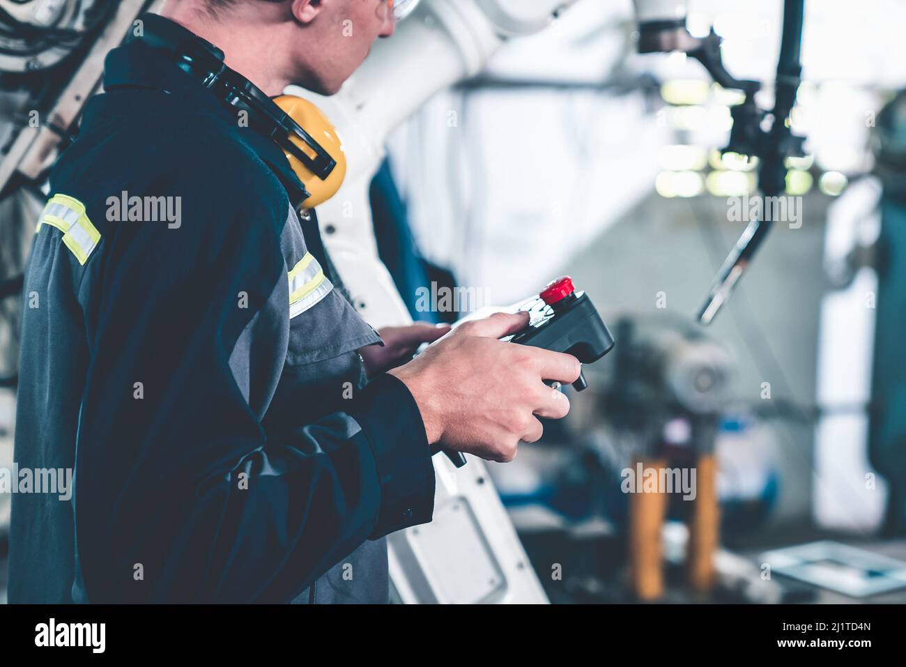 Young Factory Worker Working With Adept Robotic Arm In A Workshop Industry Robot Programming