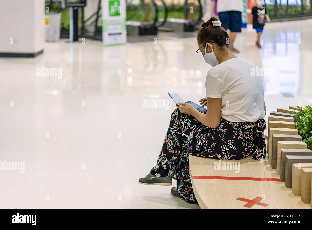 Back view of Asian woman wear face mask to prevent Corona virus (Covid ...