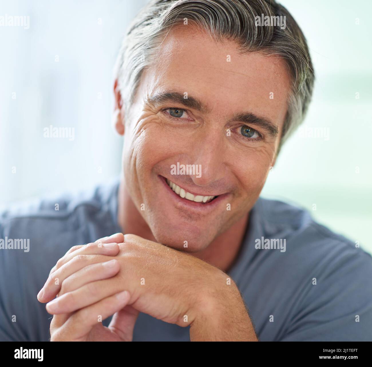 That smile has melted man a heart. Portrait of a handsome mature man ...