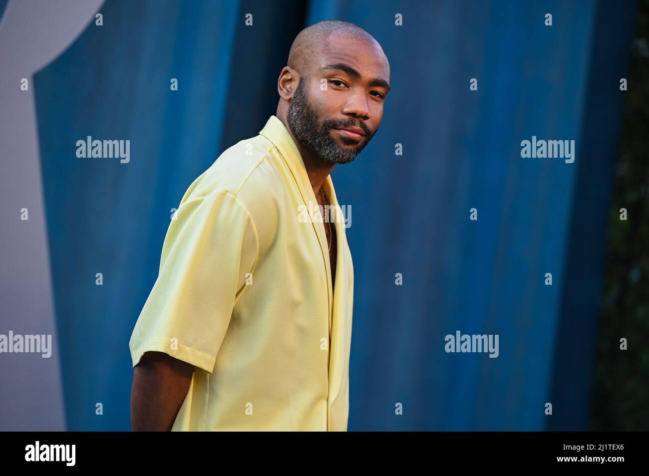 Donald Glover walking on the red carpet at the 2022 Vanity Fair Oscar ...