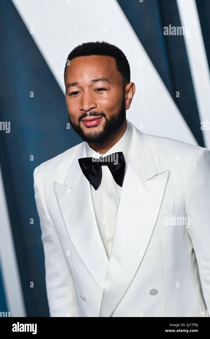John Legend walking on the red carpet at the 2022 Vanity Fair Oscar ...