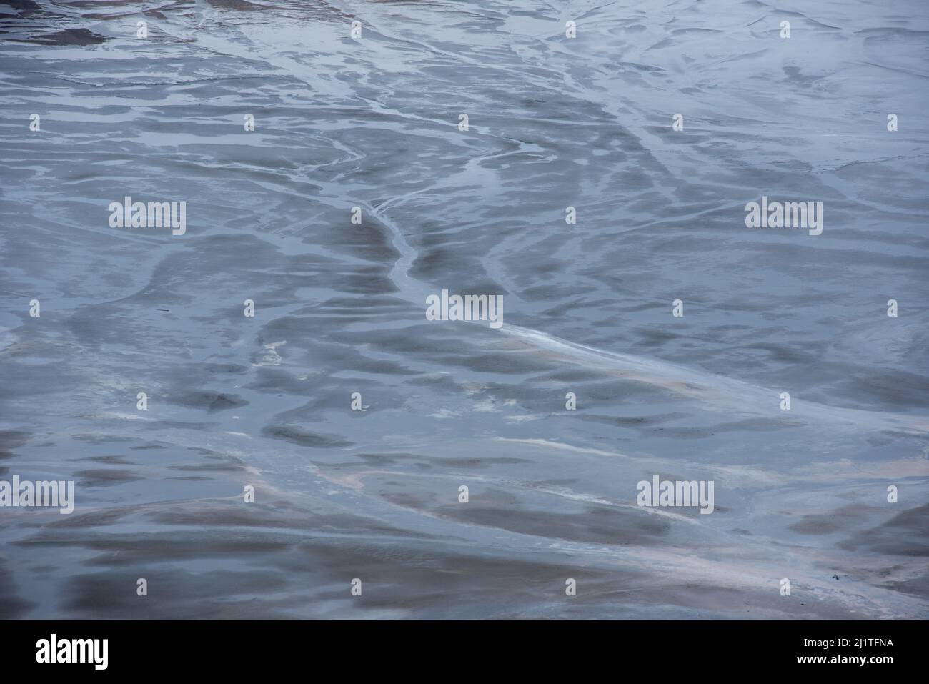 Muddy waters in a decantation pond. Toxic residuals from a copper mine ...