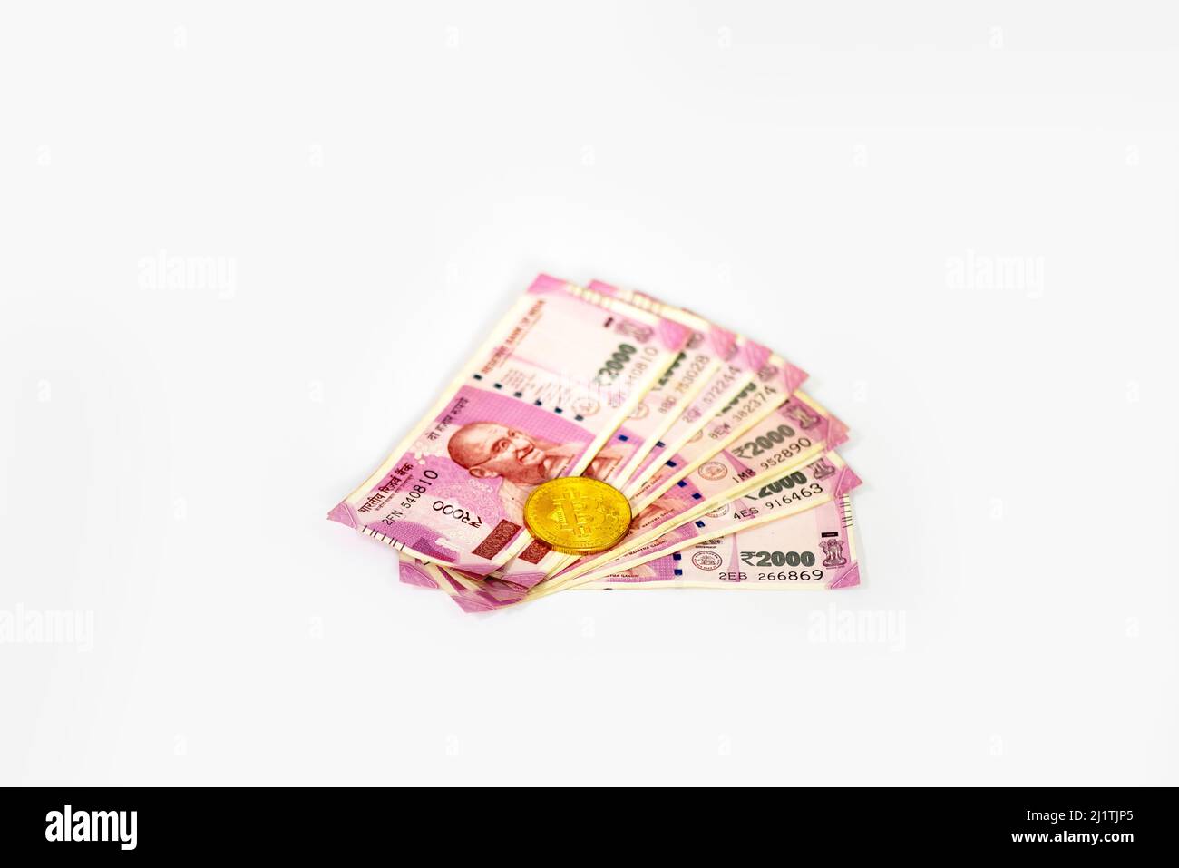 Indian rupees and bit coin isolated on white background Stock Photo - Alamy