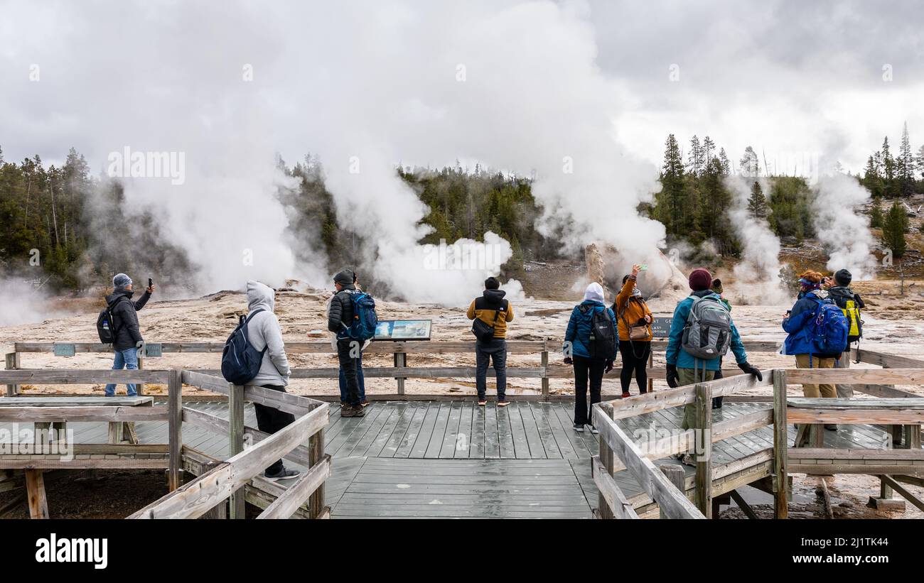 Wyoming, USA - October 1, 2019: Tourists on wooden bridge on hot zone ...