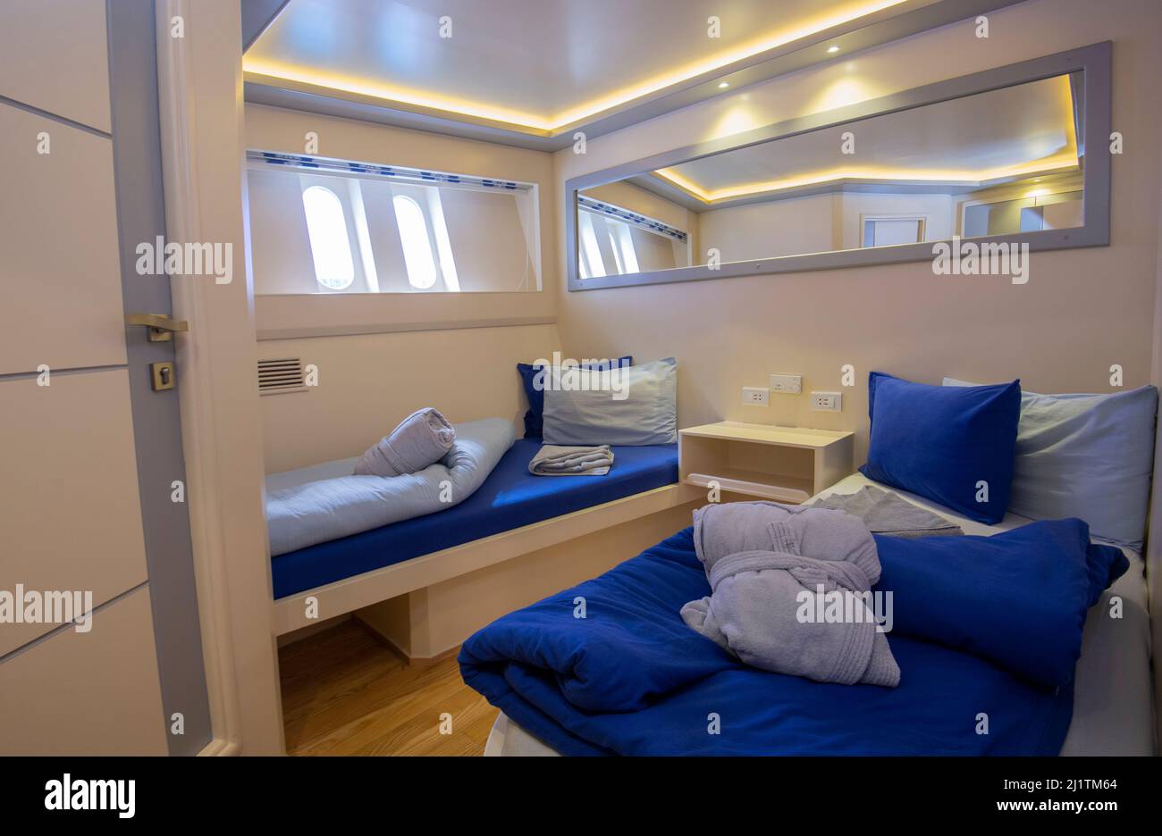 Interior decor of cabin bedroom on luxury sailing yacht with twin beds ...
