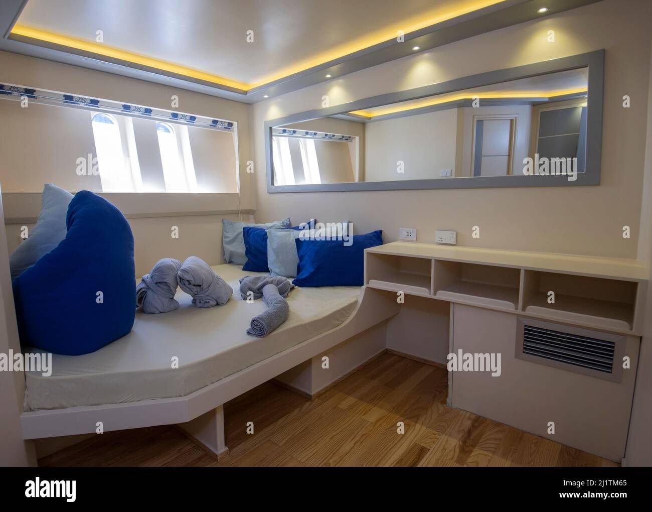Interior decor of cabin bedroom on luxury sailing yacht with double bed ...