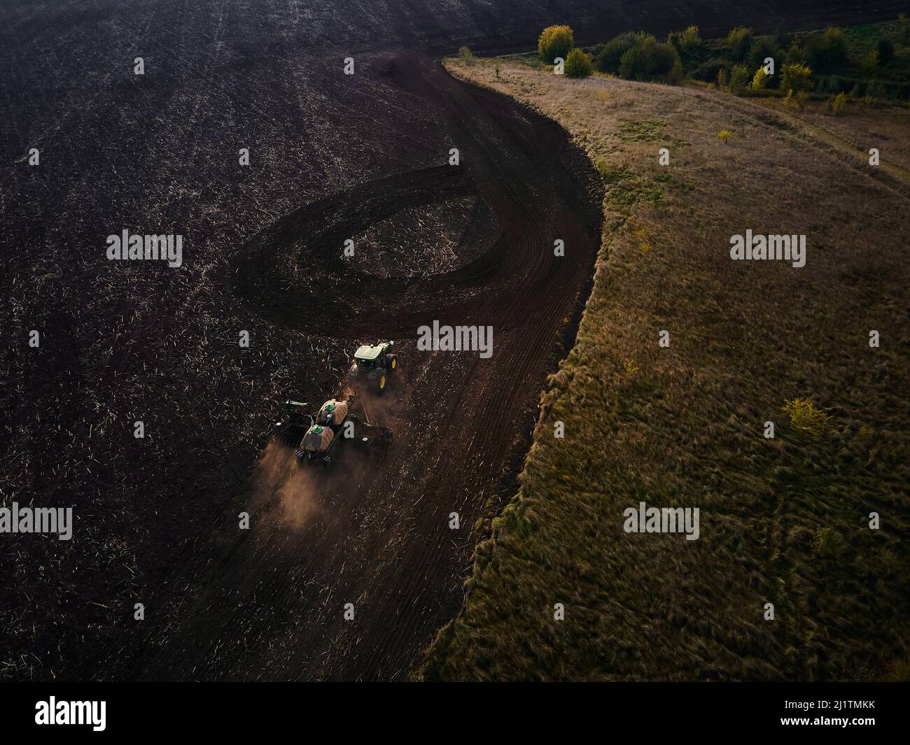 Tractors plow a dry field hi-res stock photography and images - Alamy
