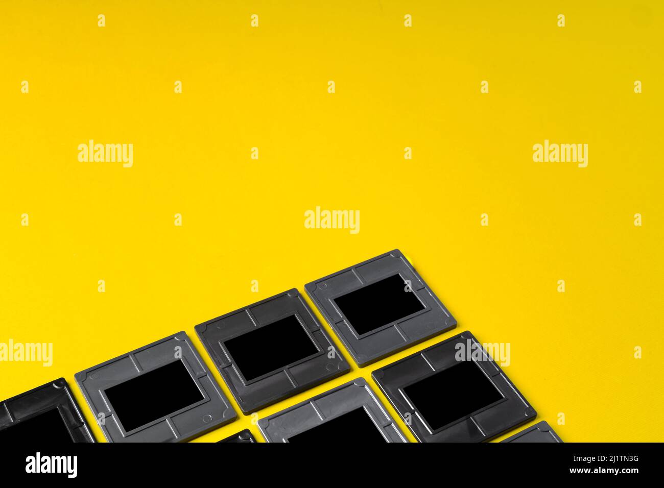 Photography empty slide frames on yellow background Stock Photo - Alamy