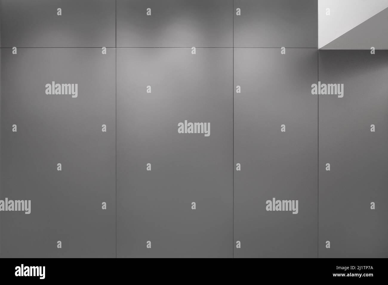 A modern interior with a gray secret wardrobe with no handles Stock ...