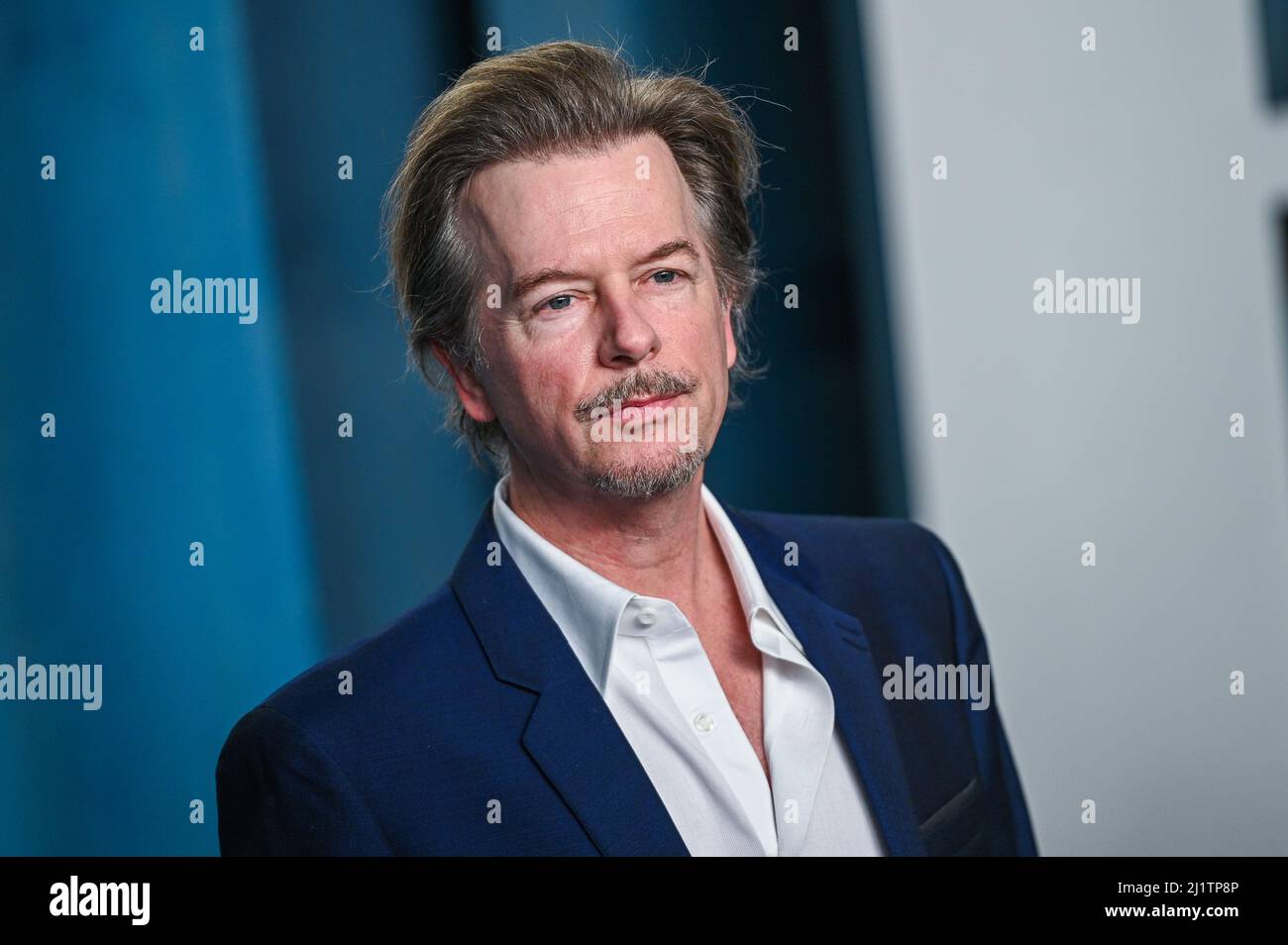 David Spade walking on the red carpet at the 2022 Vanity Fair Oscar ...
