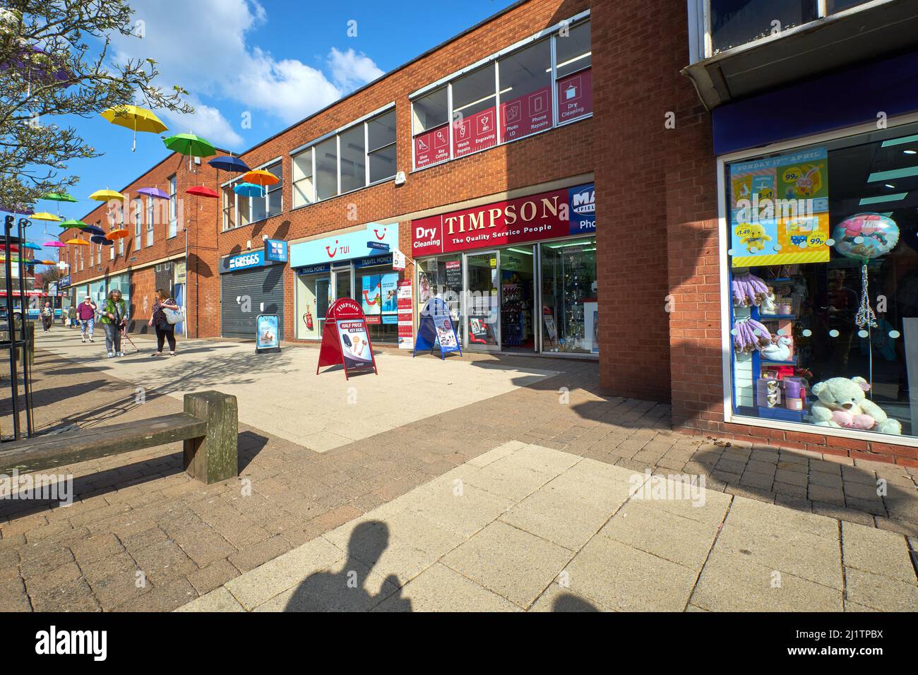 Small shops in a town center Stock Photo - Alamy