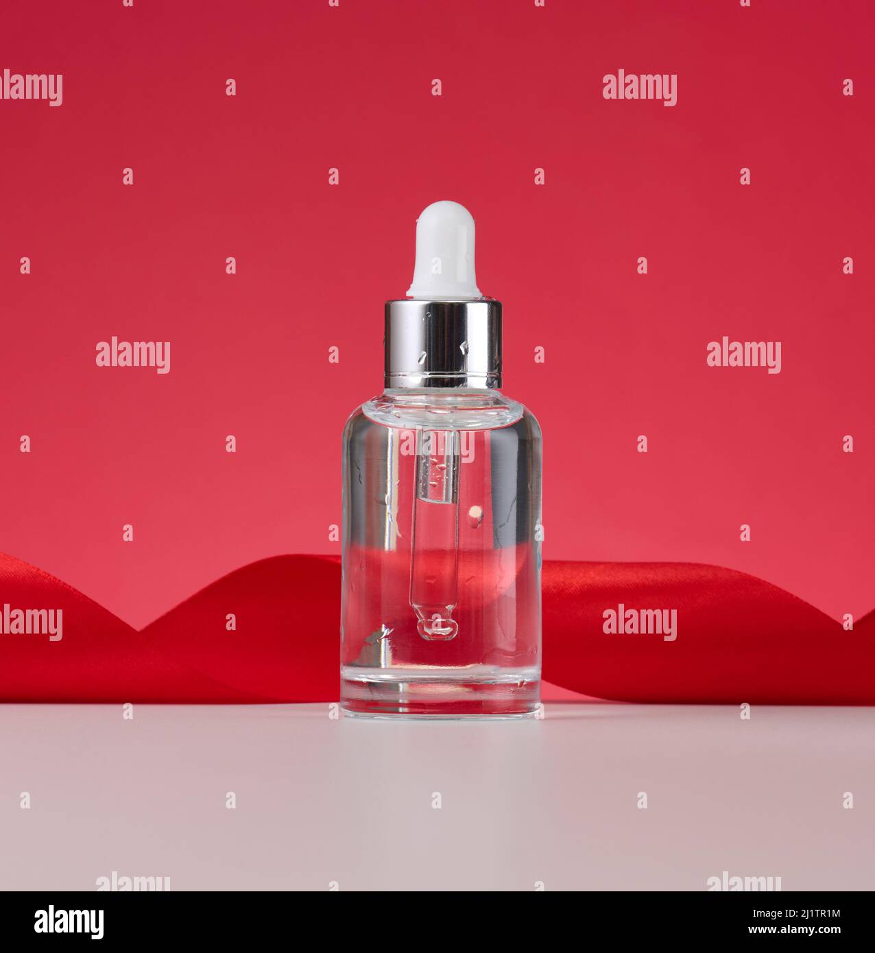 glass transparent white bottle with a pipette. Container for cosmetics ...