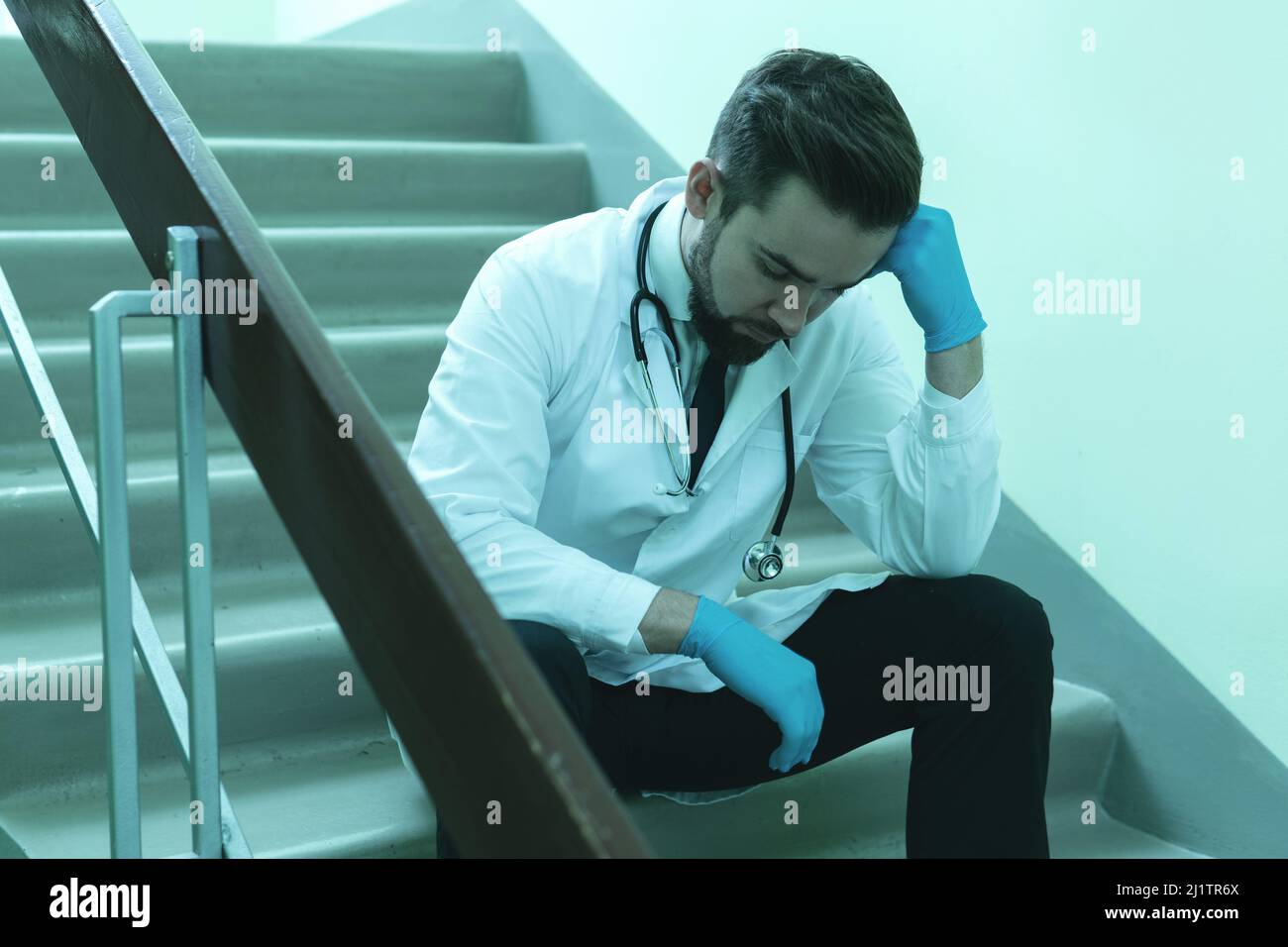 Exhausted doctor after long shift in the hospital Stock Photo - Alamy