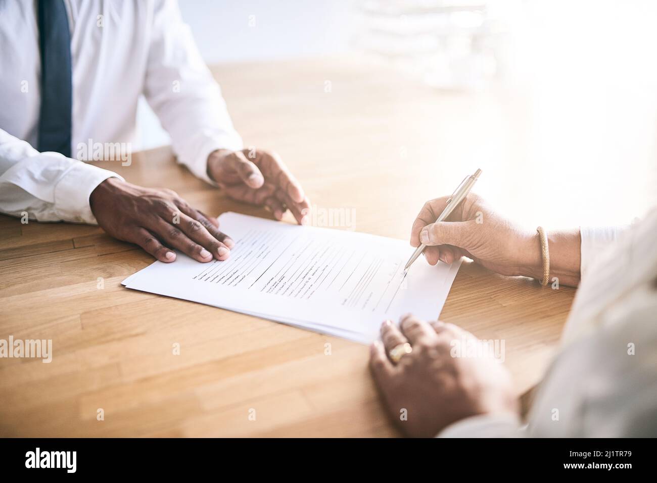 Just sign here and thats that. Shot of a unrecognizable business person ...