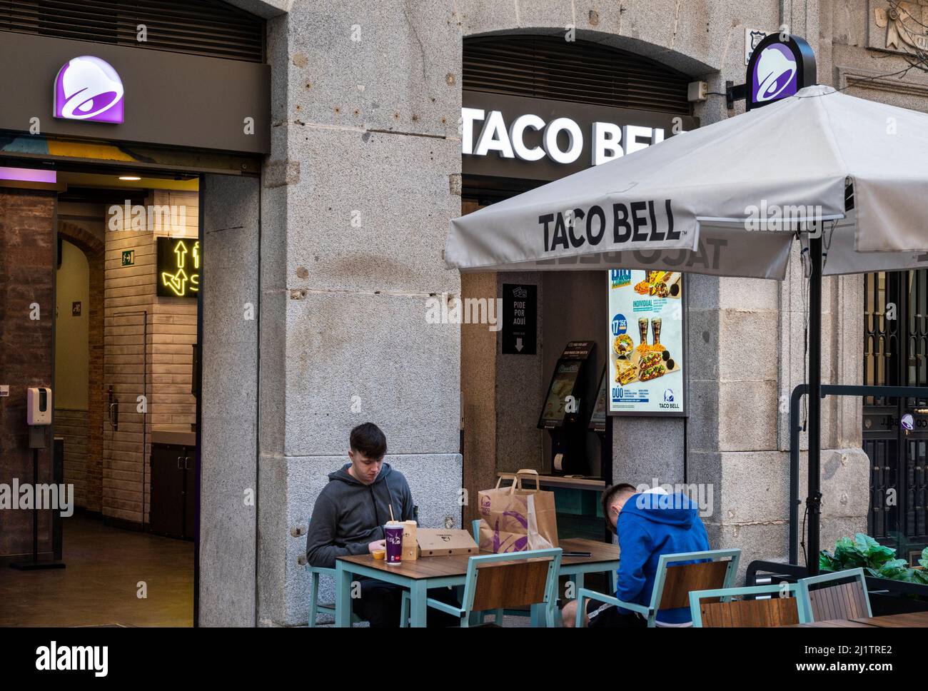 Customers eat at the American chain of fast-food restaurants Taco Bell ...