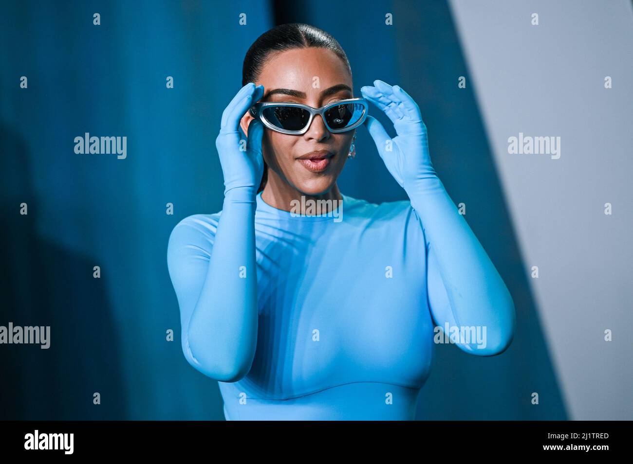 Kim Kardashian walking on the red carpet at the 2022 Vanity Fair Oscar ...