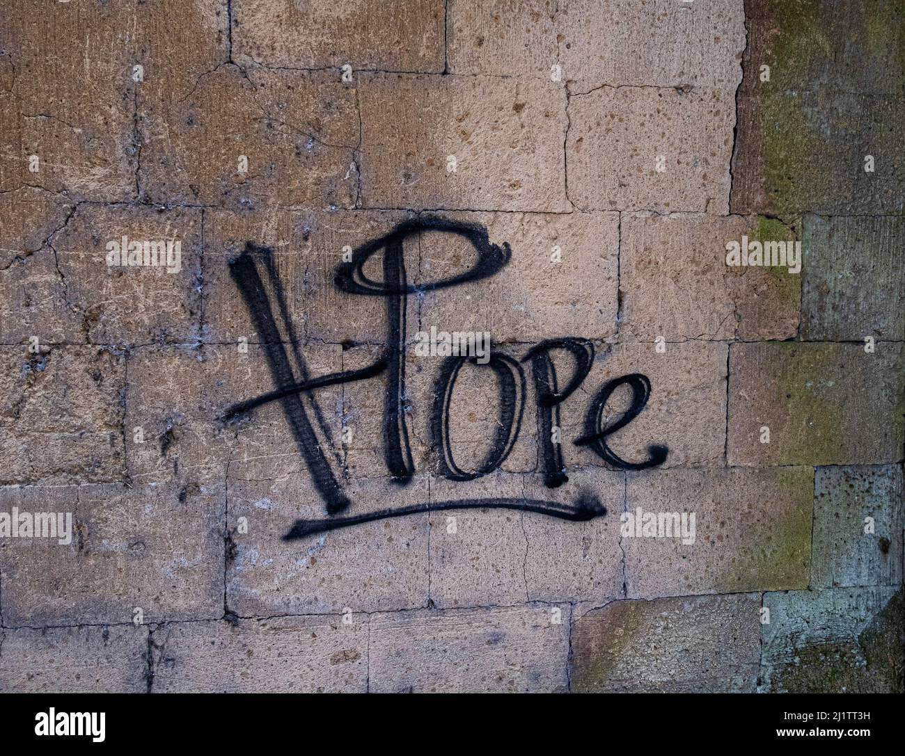 Distressed concrete wall in Indonesia with the word HOPE spray painted ...