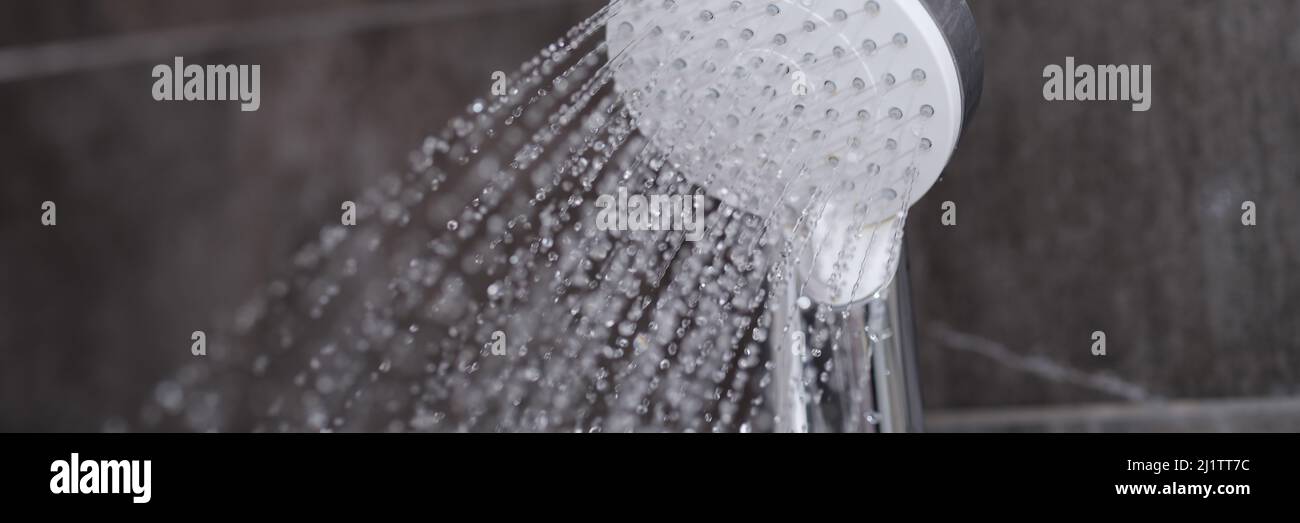 Splashing water from the mixer in the bathroom for a shower Stock Photo ...