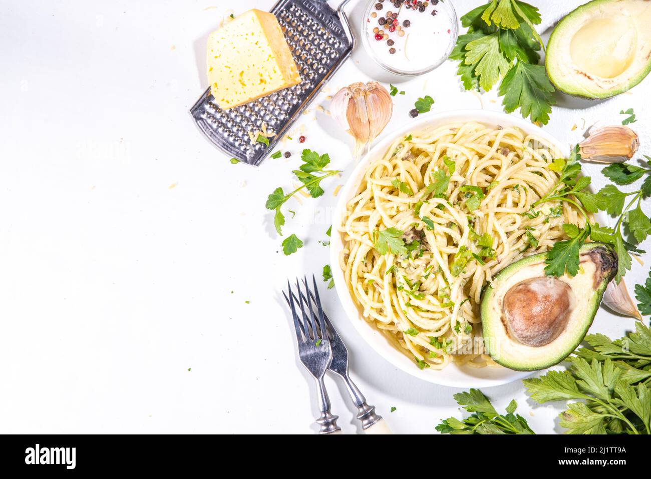 Spaghetti pasta with creamy cheese avocado pesto sauce. Healthy italian ...