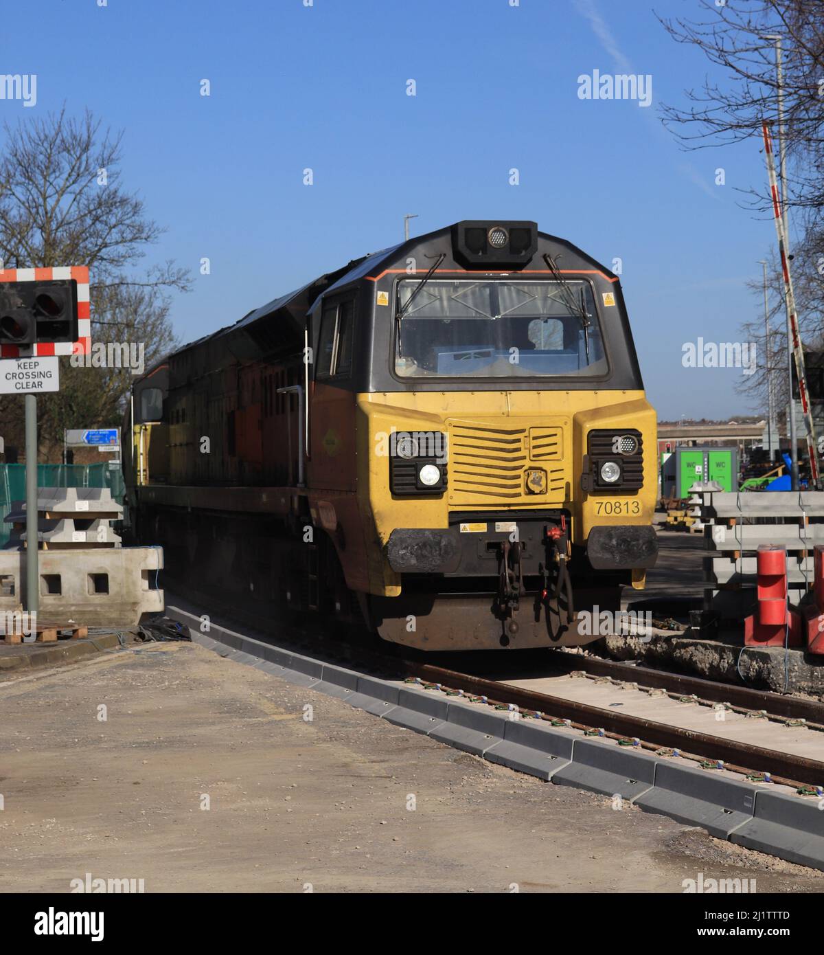 Colas Rails diesel locomotive 70813 slowly crossing the being rebuilt ...