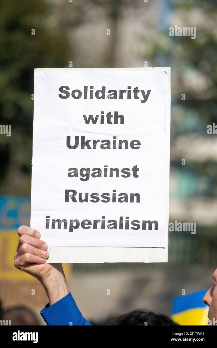 Protesters with signs at the London Stands With Ukraine demonstration ...