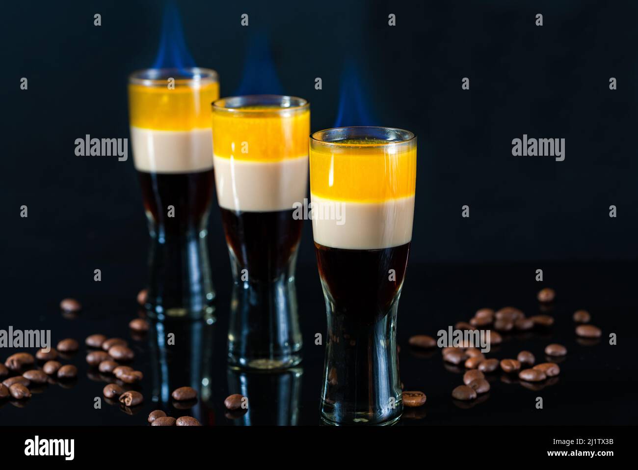 B-52 cocktail flambe (flamed) - layered shot composed of coffee liqueur ...