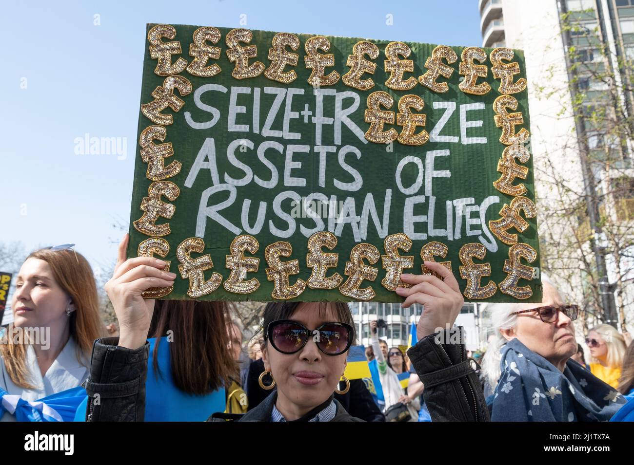Protesters with signs at the London Stands With Ukraine demonstration ...