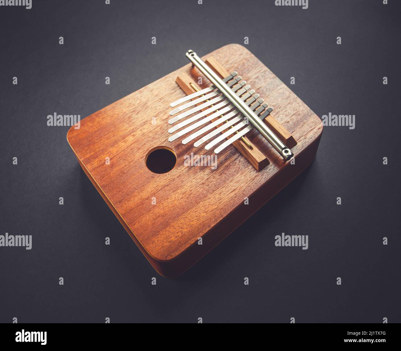 Traditional wooden kalimba isolated on black background Stock Photo - Alamy