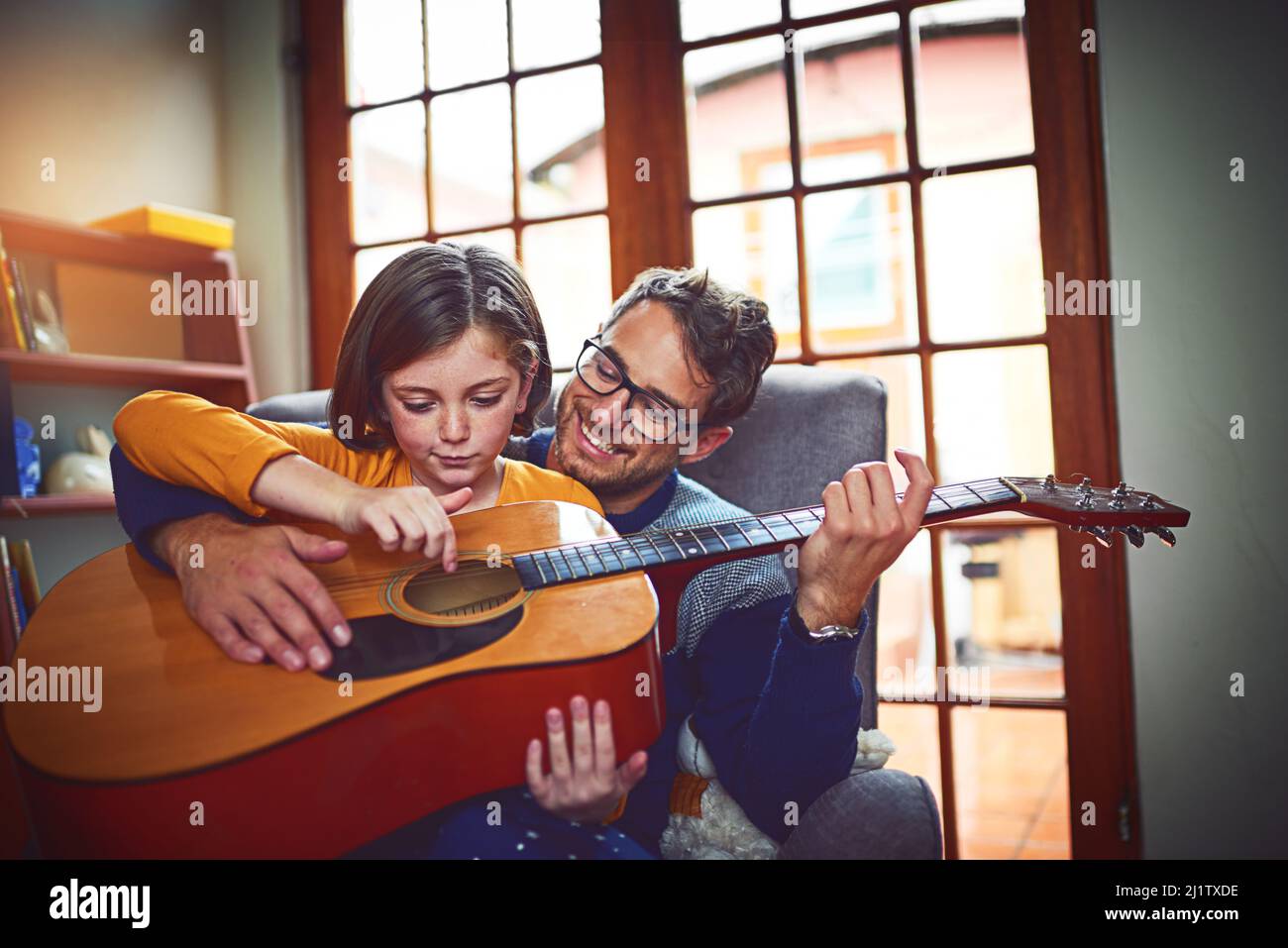 Theyre a father and daughter rockstar duo. Shot of a little girl ...