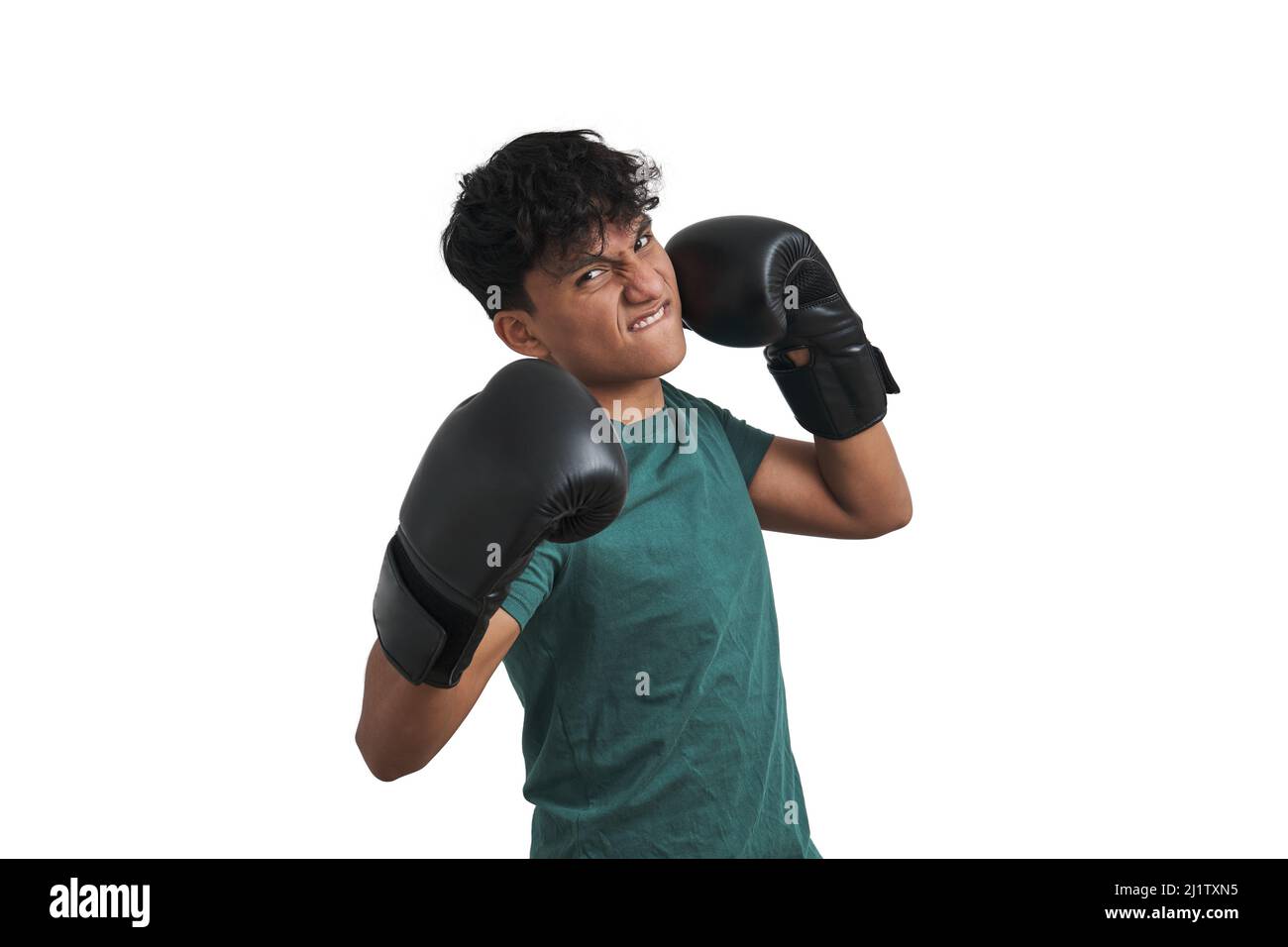 Young peruvian boxer throwing a chopping right, isolated Stock Photo ...