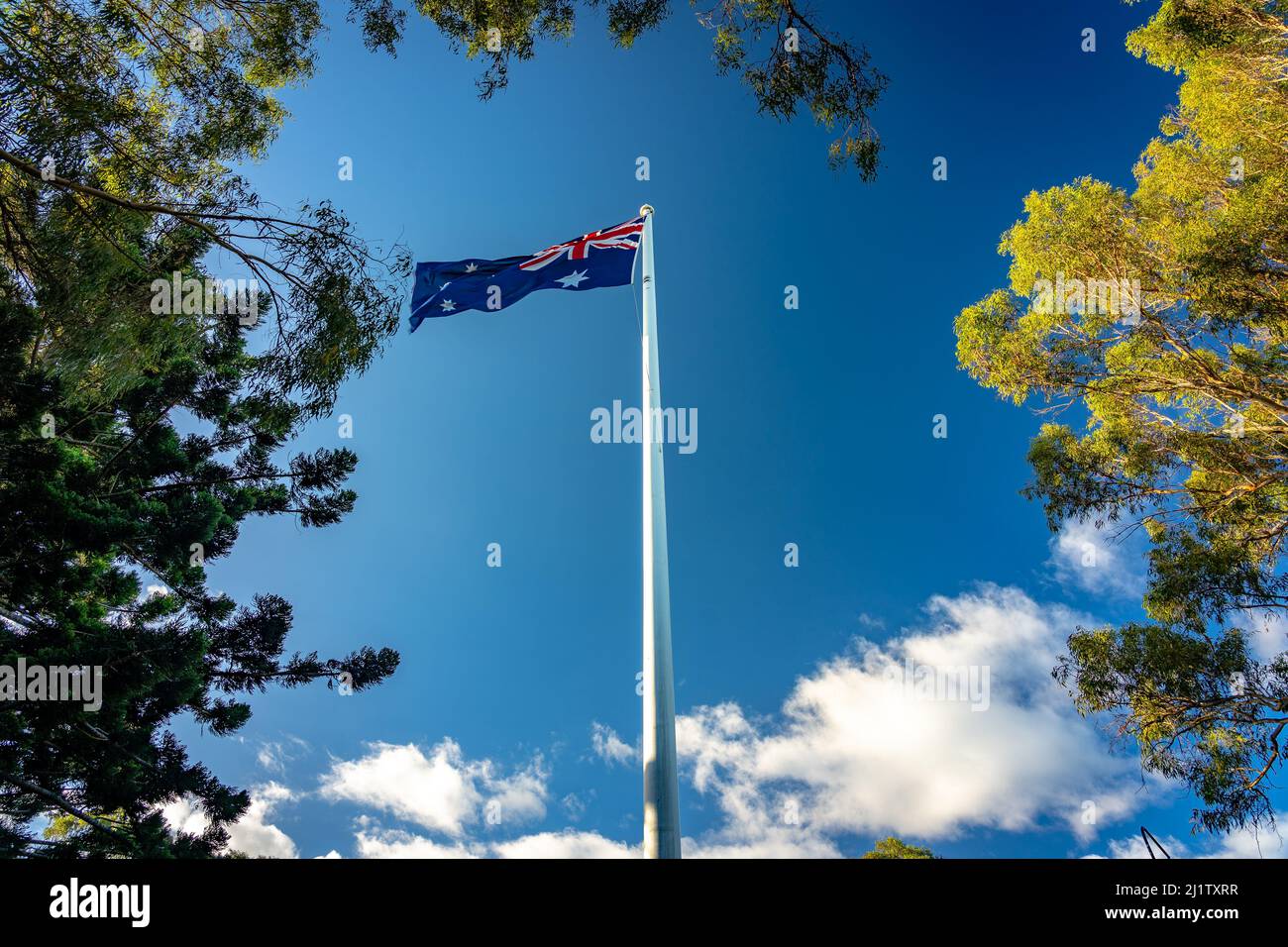 Australian flag waving in the air Stock Photo - Alamy